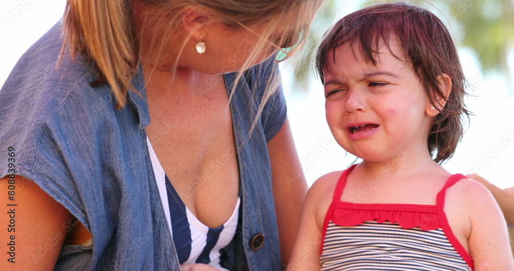 Upset little girl child crying and complaining mother hugging daughter calming Stock Photo ...