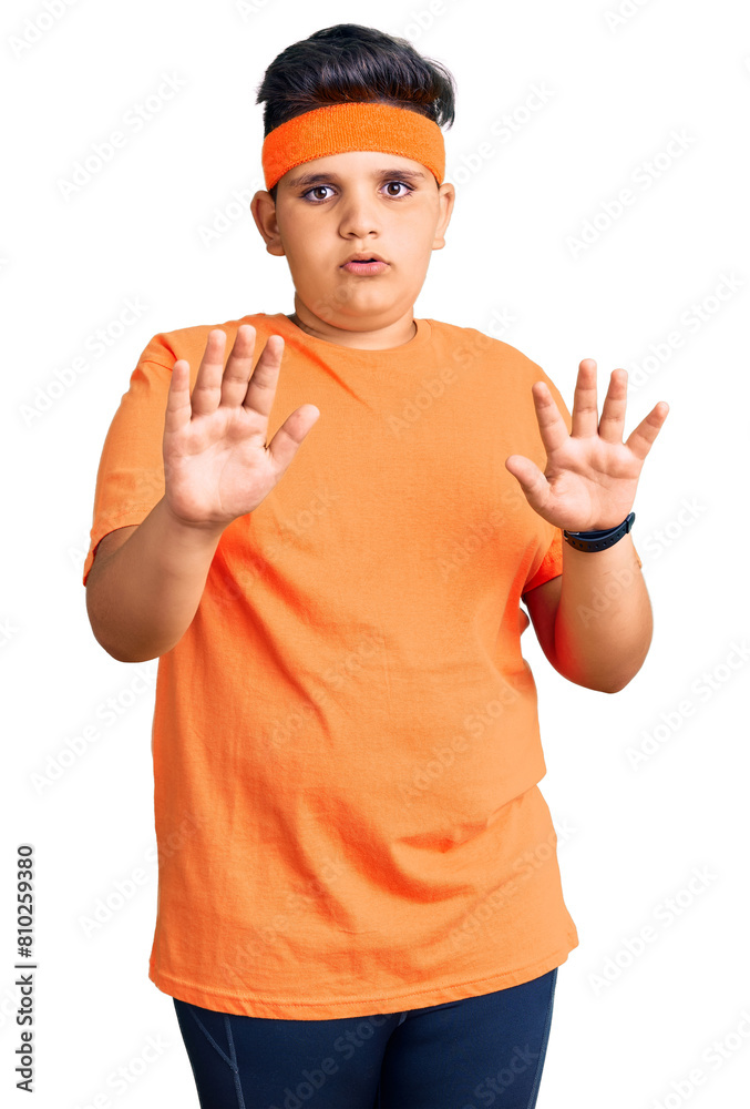 Little boy kid wearing sportswear moving away hands palms showing ...