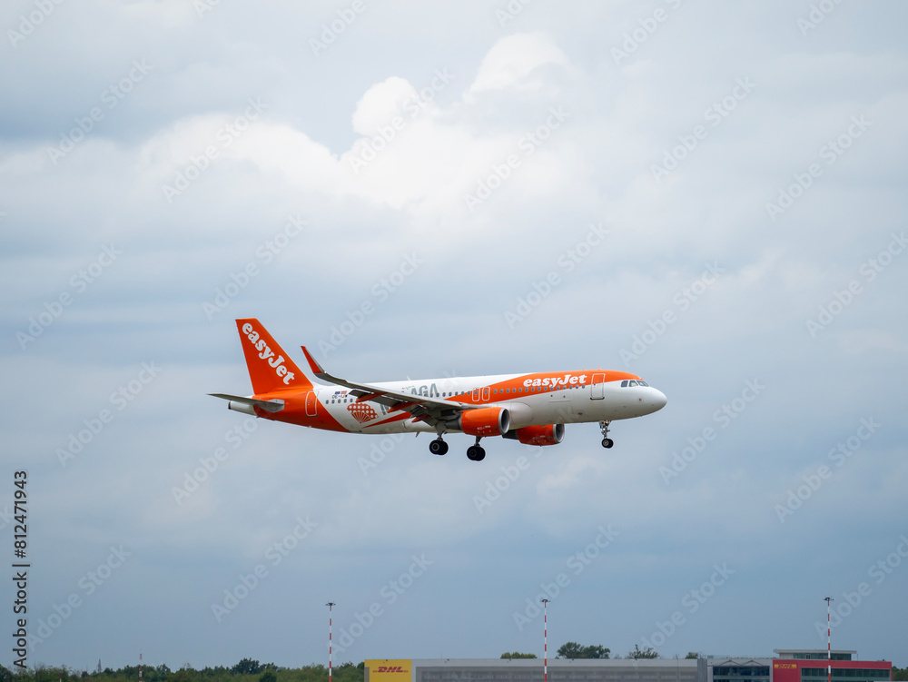 Easyjet Airbus A320 is landing at MXP Milano Malpensa international airport. Malaga livery Stock ...