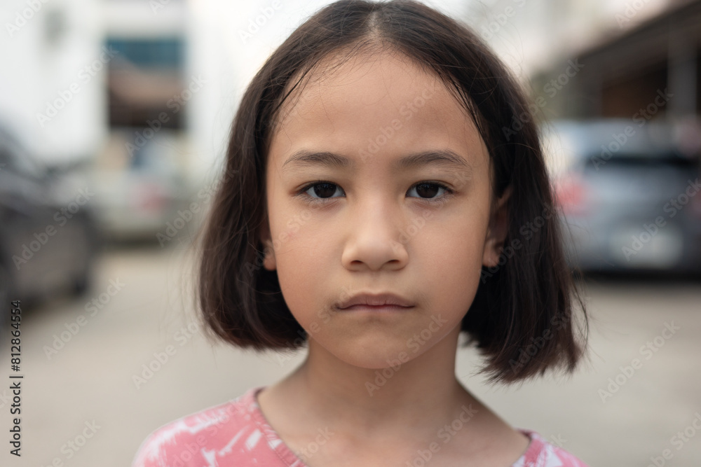 Face and eyes closed up of adorable Asian kid girl who is looking and ...
