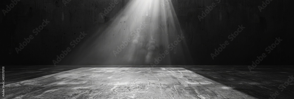 Spotlight in a dark room with concrete floor and brick wall. Dark room ...
