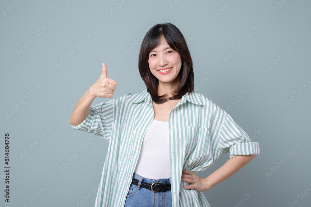 Very good. Smiling asian enterpriser woman showing okay with satisfied ...