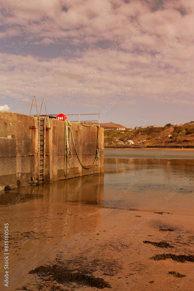 Harbour sea wall at Porth Nefyn, Gwynedd, North Wales. Taken at low ...