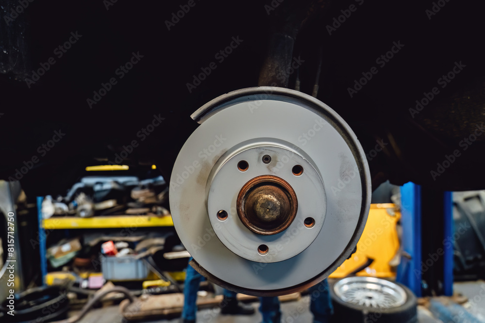 The rim is removed showing the rotor and caliper. Disc brake on car in ...