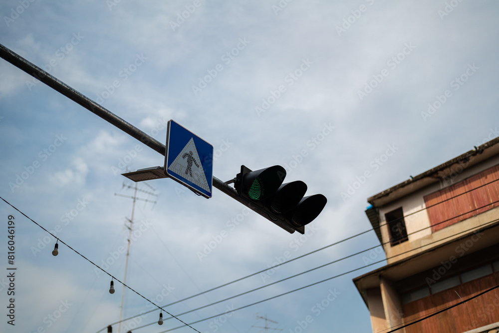 Pedestrian traffic crossing light in green signal at the urban city ...
