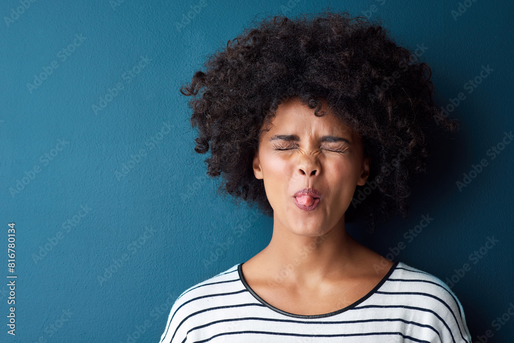 Portrait, emoji and tongue with facial expression in studio for fun ...