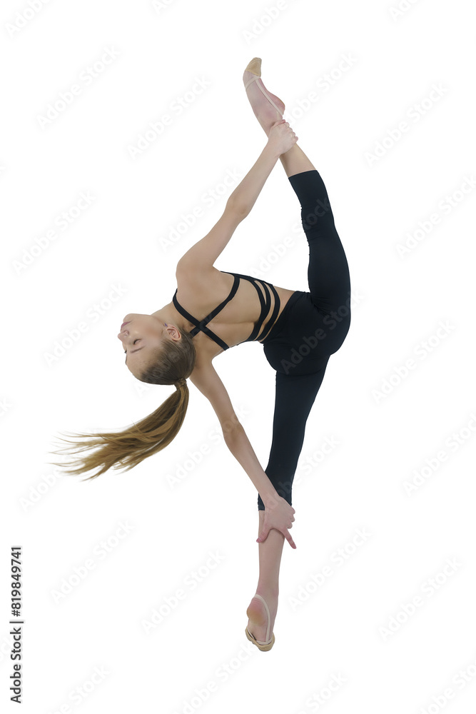 young gymnast in a photo studio shows stretching while doing splits ...