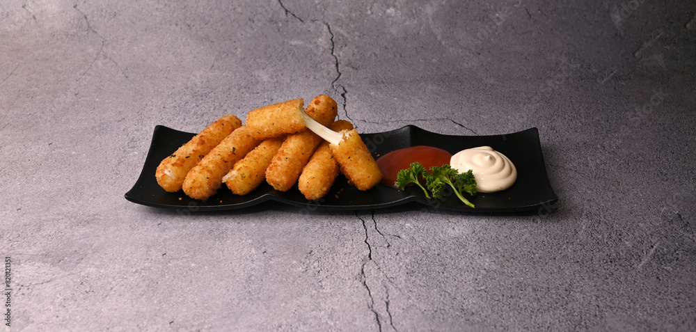 Crispy and cheesy mozzarella sticks, coated with a golden bread crumb ...