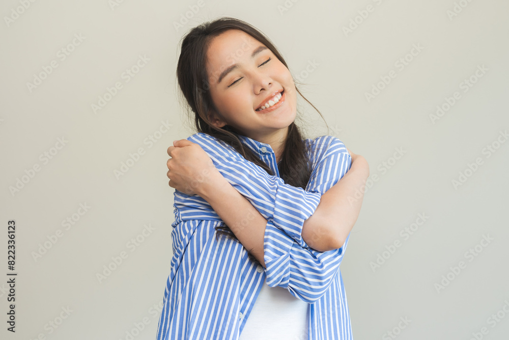Smiling positive, hug self care happy asian young woman hands hugging ...