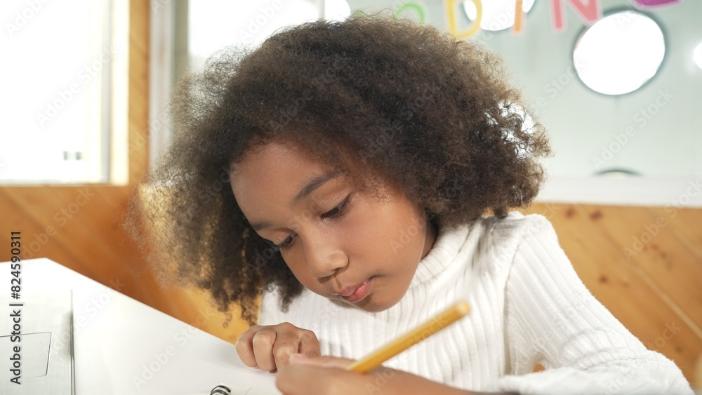 Smart african girl inspect data analysis while writing down on paper ...