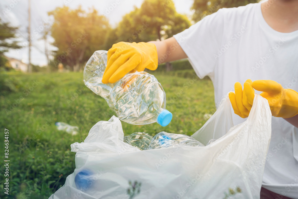 Volunteer teenage boys picking plastic bottle waste at public parks for ...