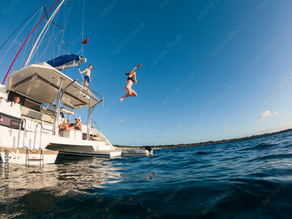 Adventure luxury Travel catamaran boating Caribbean kids jumping Stock ...