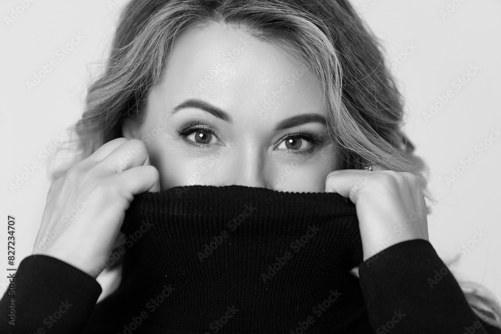 Monochrome Portrait of Young Blonde Woman Hiding Face in Black Sweater ...