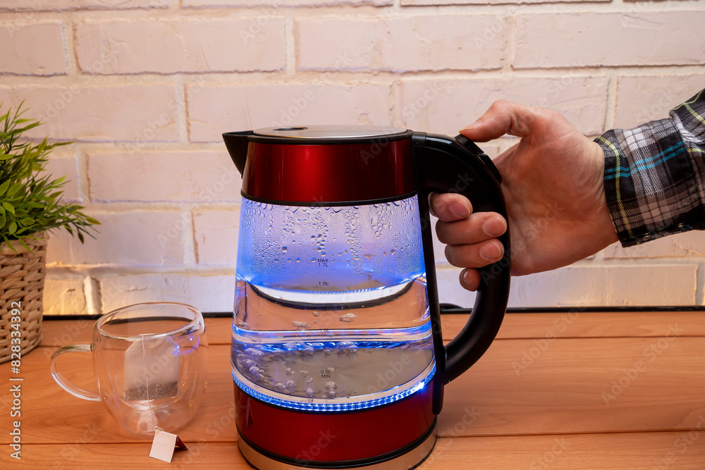 kettle with boiling water and condensate on glass walls Stock Photo ...