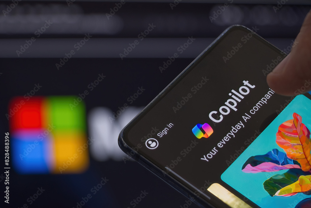 Copilot icon visible on mobile phone screen, Microsoft logo in the ...