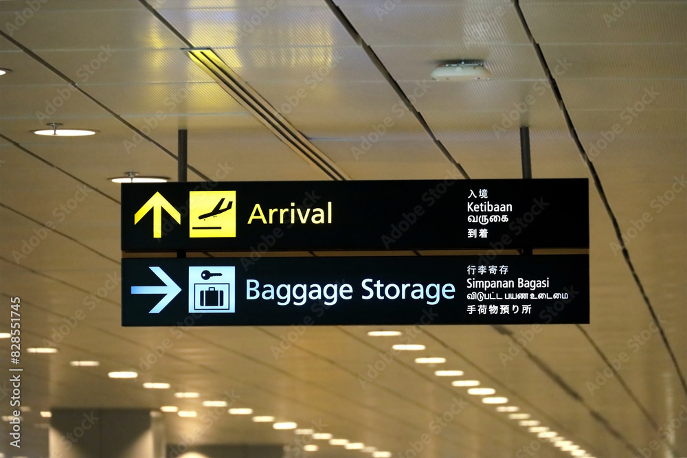 Arrival and luggage storage signs at Singapore Changi Airport. Stock ...