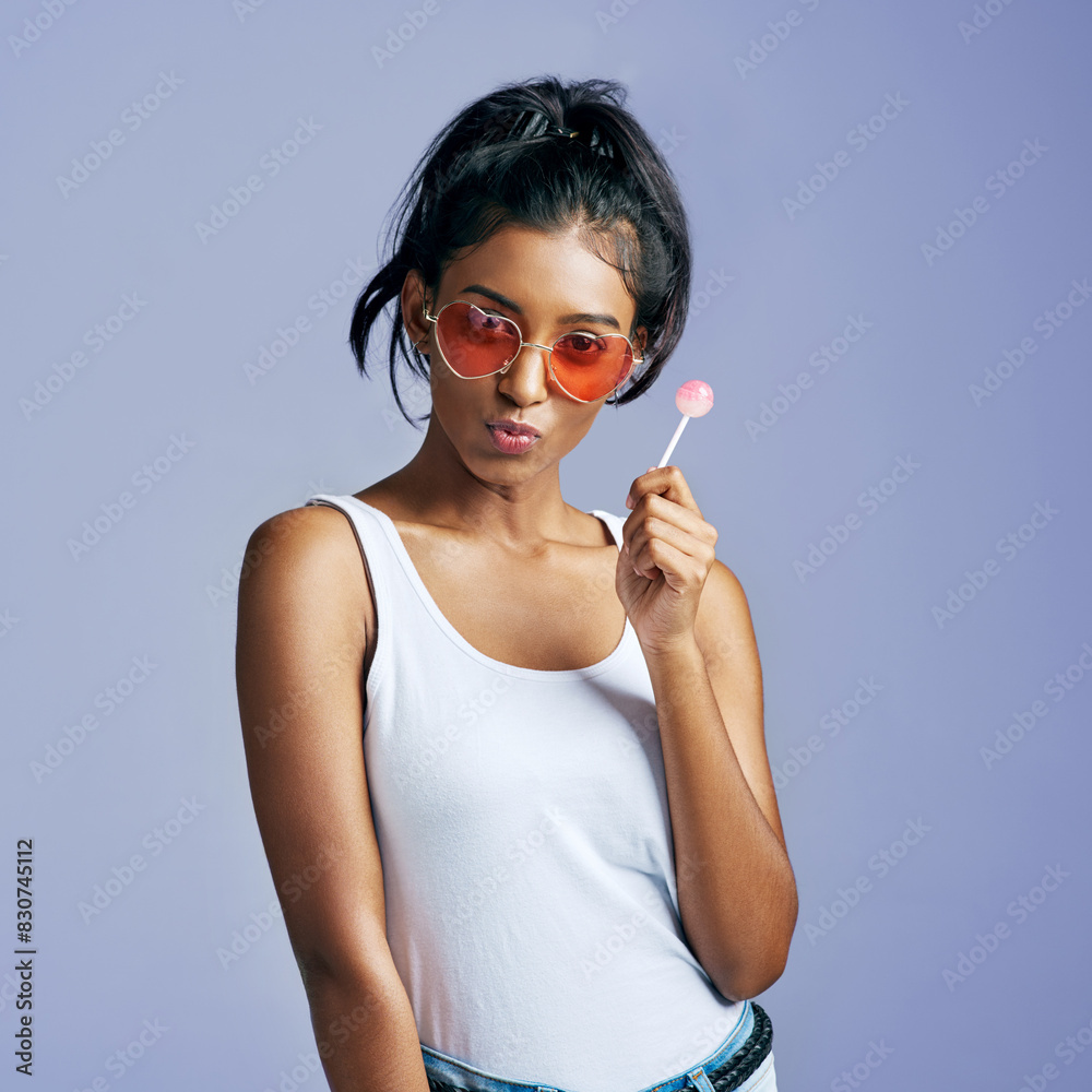 Girl, portrait and funky heart sunglasses as gen z on blue background ...