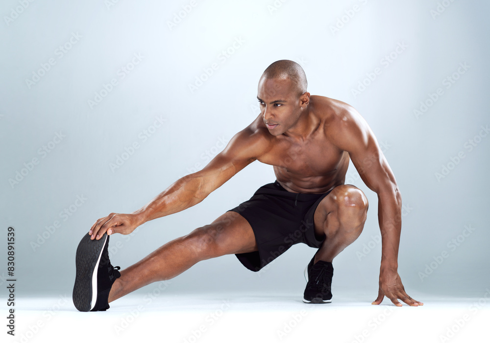 Man, legs and stretching for fitness in studio for balance, exercise ...