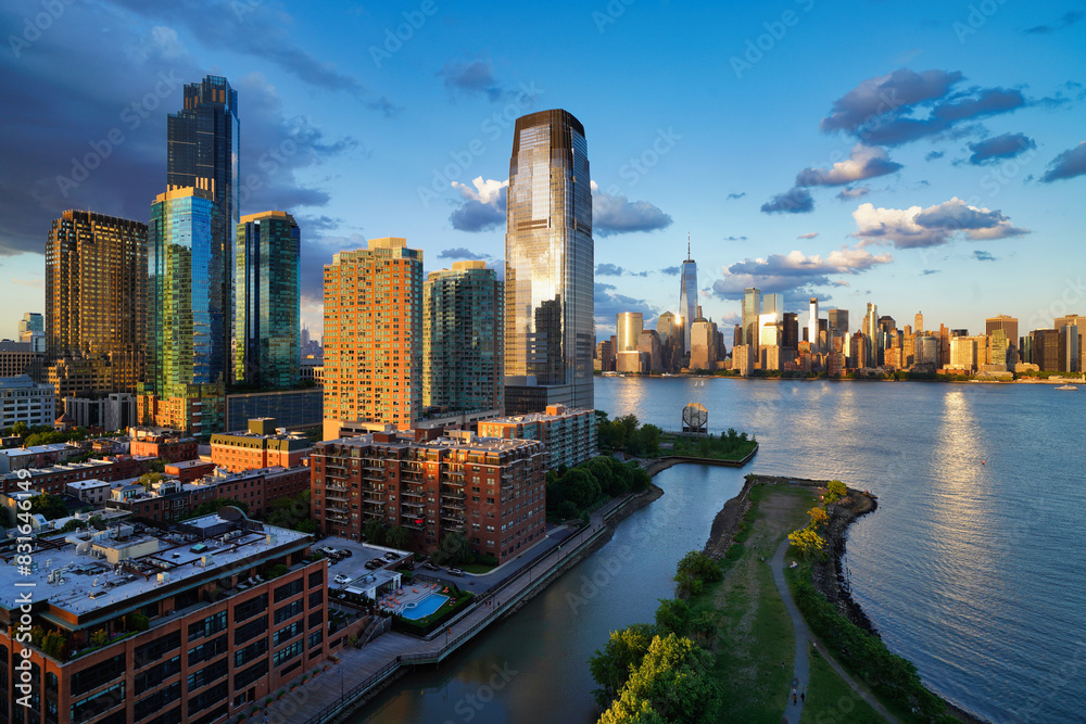 New York and Jersey City illuminated by the light of the setting sun ...