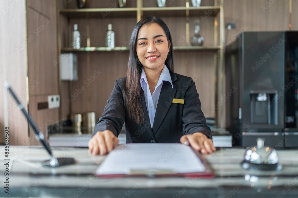 Beautiful asian hotel receptionist in uniforms at desk in lobby ...