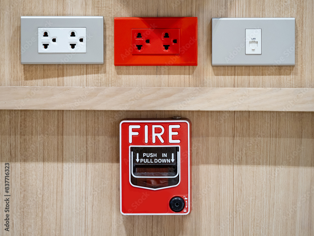 Emergency fire warning system pull station. Red fire alarm mounted on ...