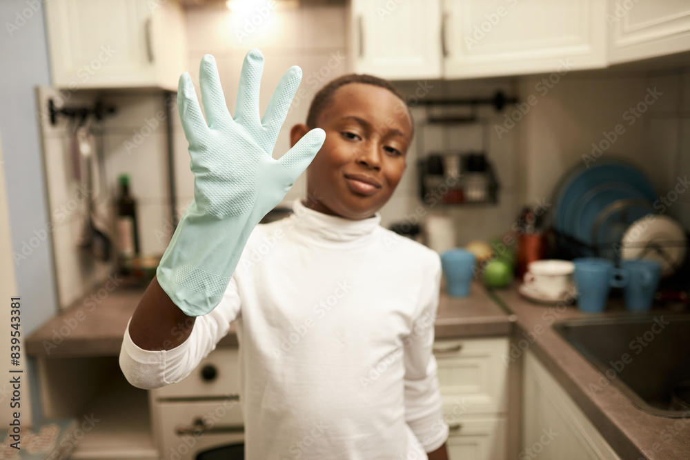 Cleaning time. Handsome african american teen boy waving hand in blue ...