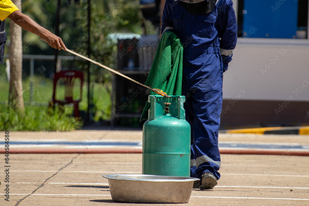Firefighters demonstrate safe use of gas cylinders to prevent accidents ...