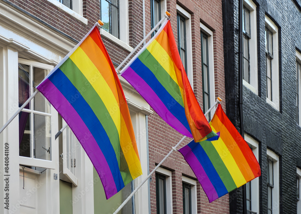 Foto de Stock Amsterdam Pride Month, many rainbow pride flags waving on ...