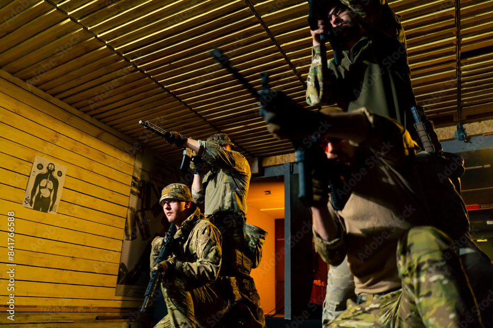 at a professional shooting range military trainers perform tactical ...
