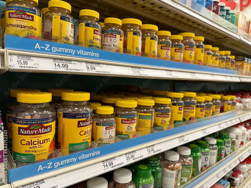 Variety of dietary and vitamin supplement products on the store shelf ...