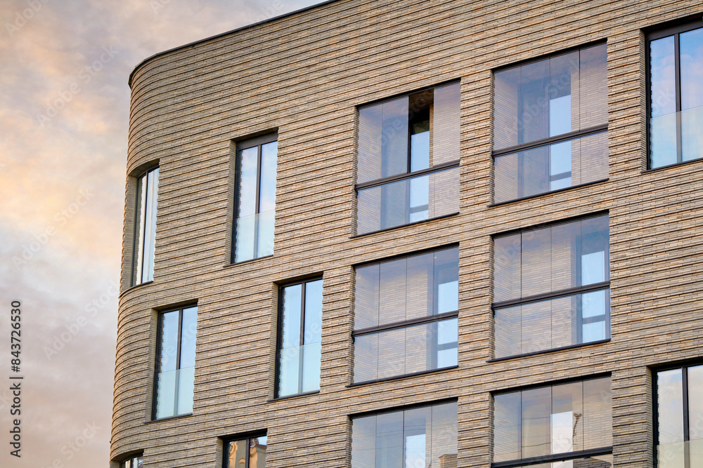 Modern residential building with large windows and clinker brick facade ...