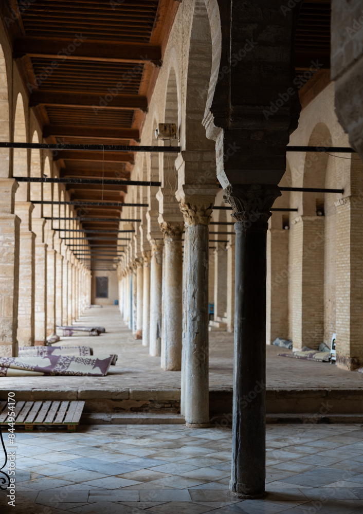 Stock-Foto „Long narrow passages under arches of temple, courtyard of ...