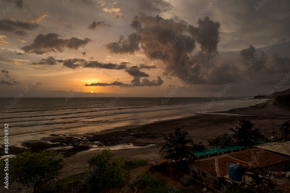Scene at sunset at Ladghar beach Dapoli, located 200 kms from Pune on ...