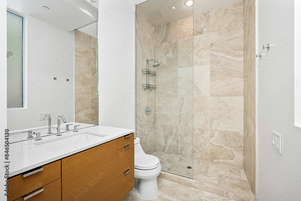 Modern bathroom with walk-in shower, toilet, vanity, and glass shower ...