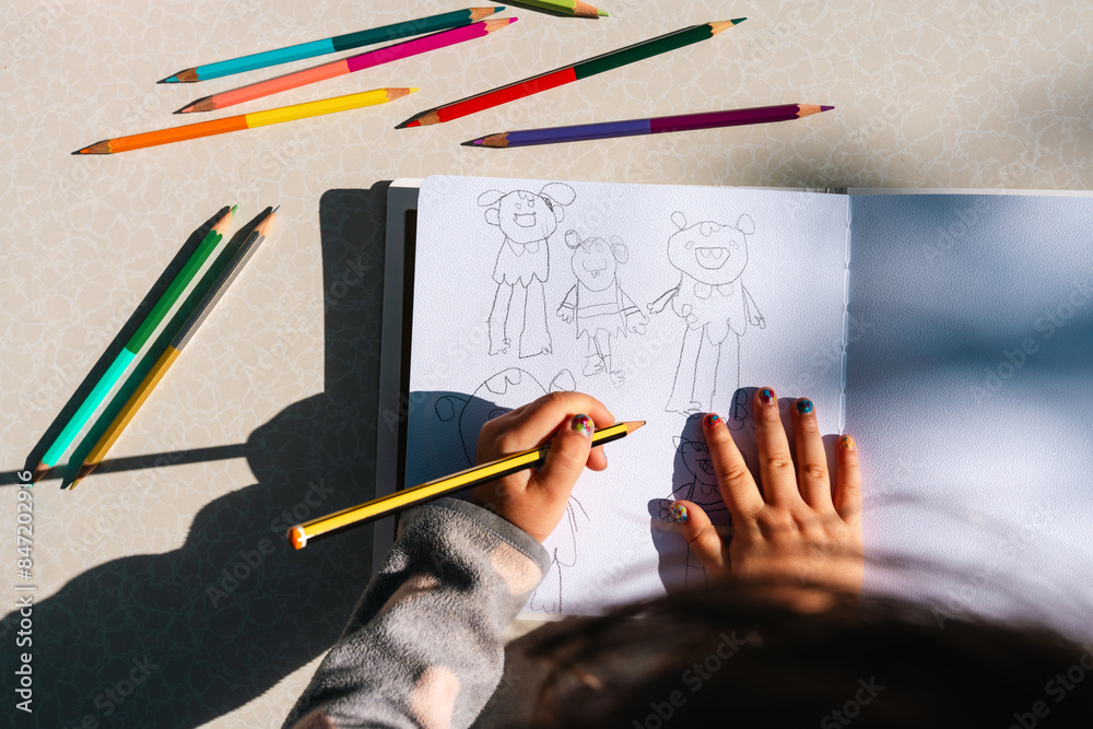 Child Drawing monsters with pencil Stock Photo | Adobe Stock