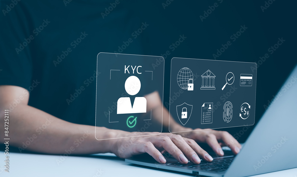 Know Your Customer (KYC) Concept. A person works on a laptop ...