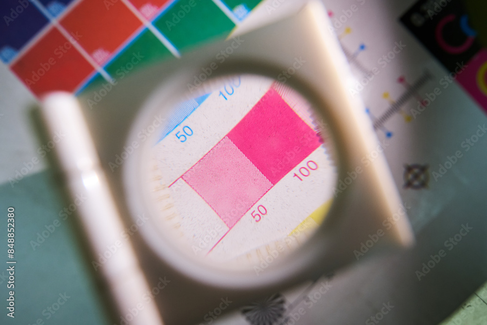 A close up detail magnifying glass showing the dot matrix printing ...