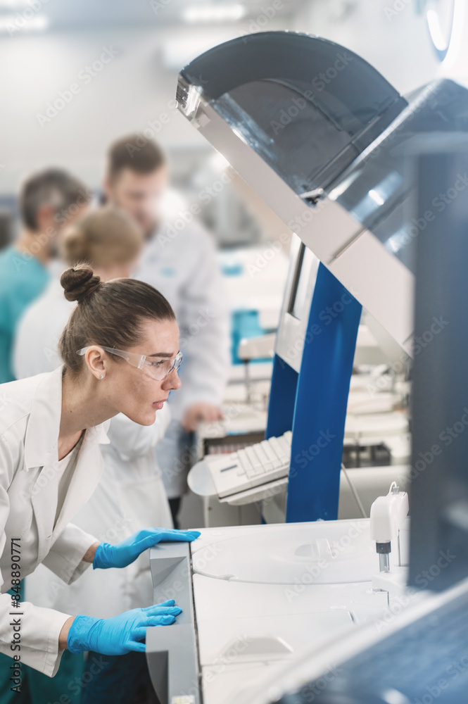 female doctor working in a modern equipped computer laboratory analyzes ...