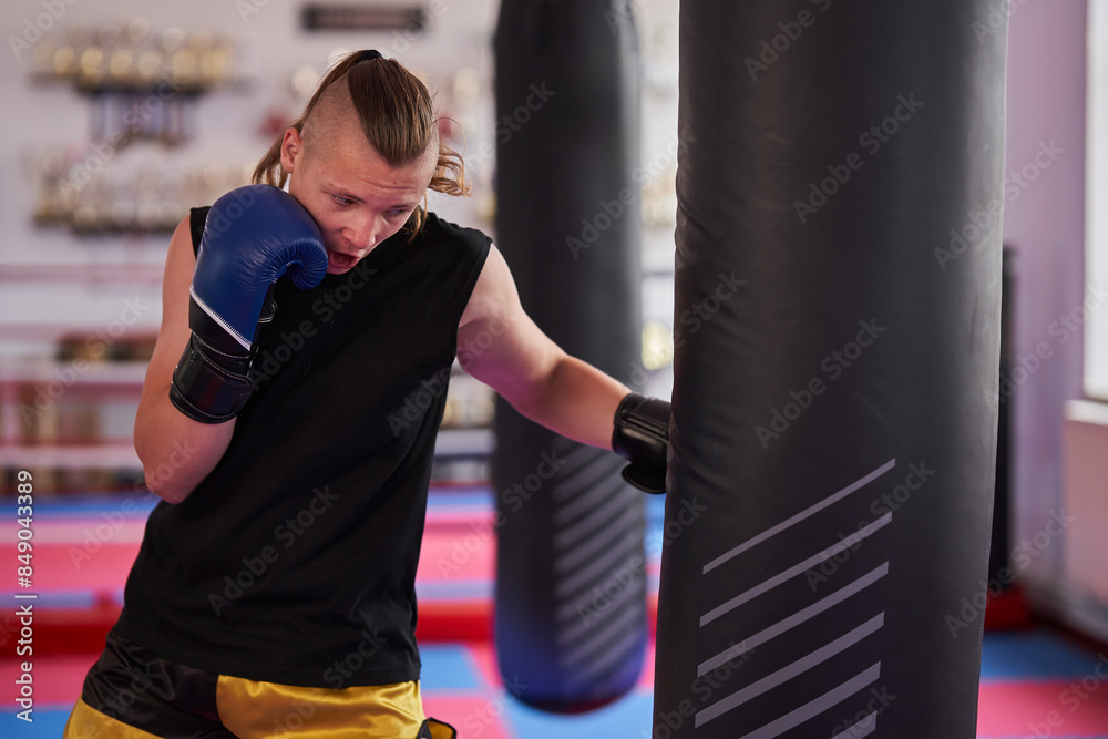 Kickboxer training on heavy bag in the gym Stock Photo | Adobe Stock
