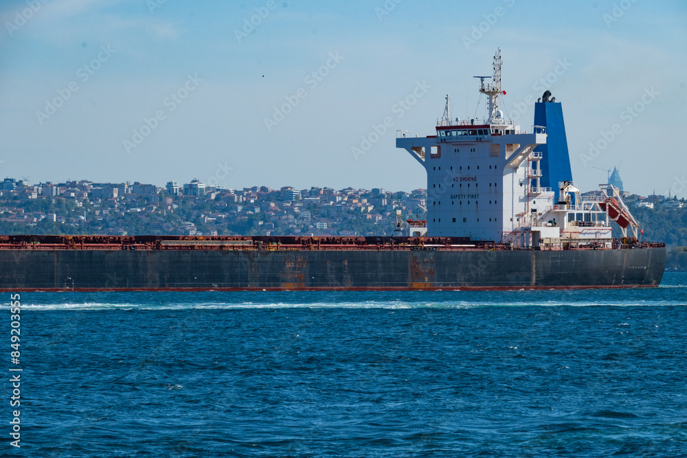 Big bulk carrier container ship navigating through the Bosphorus ...