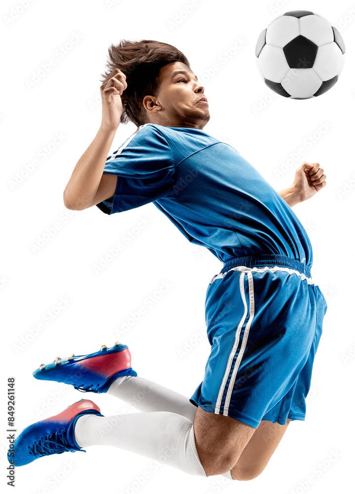 Competitive young ma, football player in blue uniform hitting ball with ...