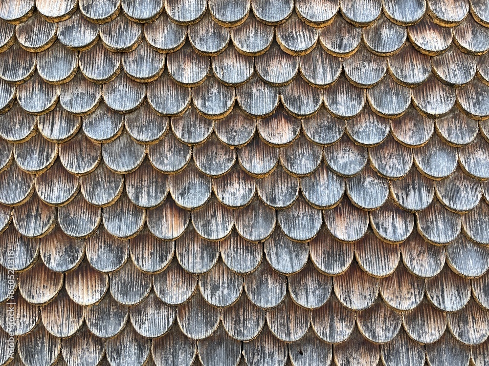 Wooden shingles which look like fish scales. Wooden facade in Bavaria ...