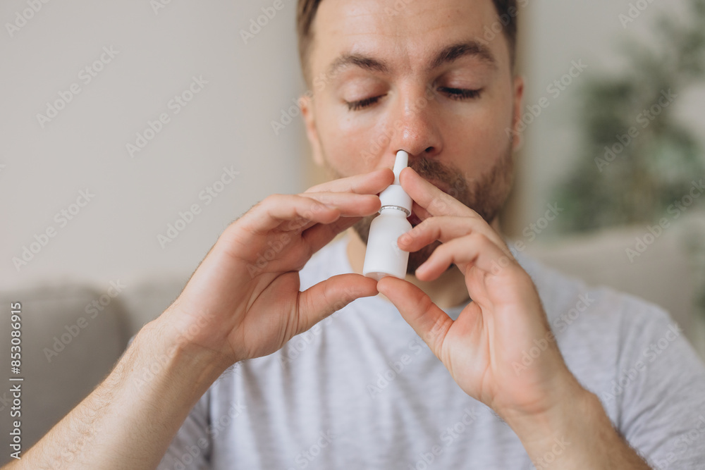 Frustrated sick unhealthy ill allergic man has red eyes runny stuffy ...