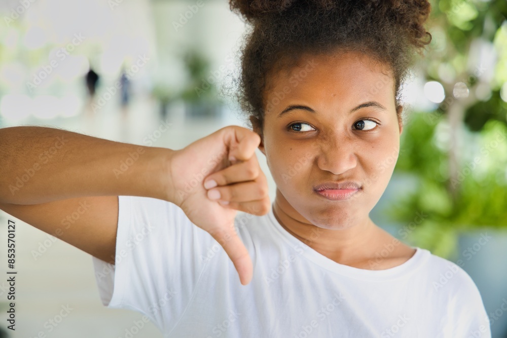 Angry African black Woman Expressing Disagreement with thumb down hand ...