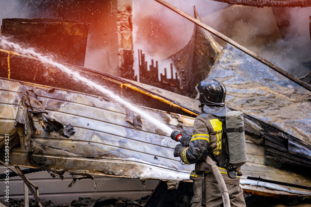 Fire incident in building. Action photo fireman team extinguishes burn ...