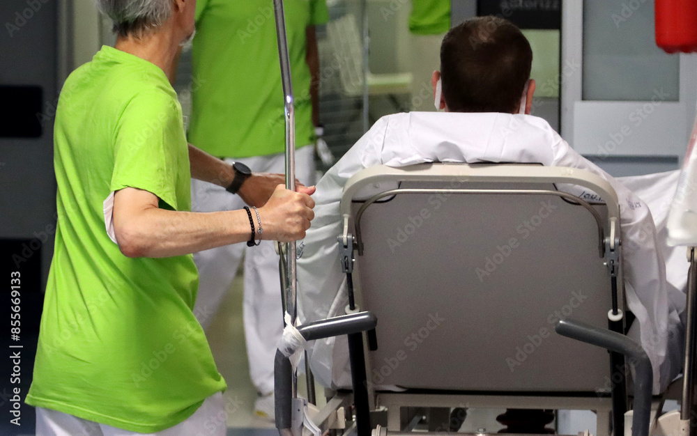 Doctors and nurses in the corridors of the emergency room of an Italian ...