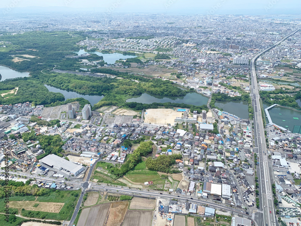 Aerial view of a cityscape featuring a blend of residential areas ...