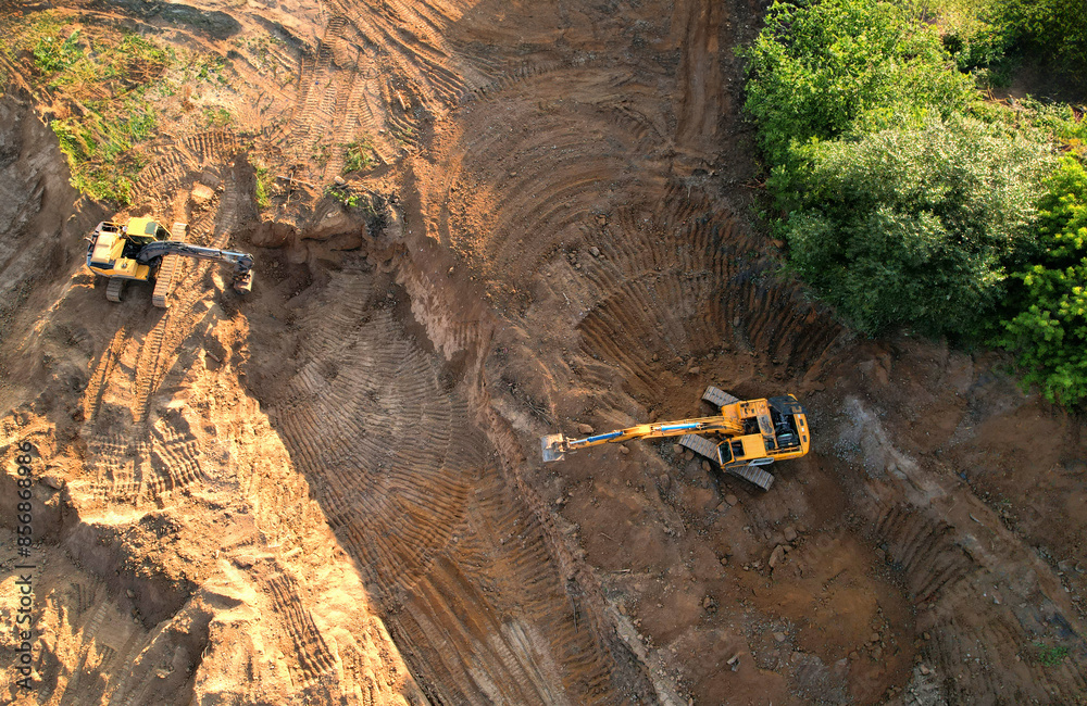 Excavator on earthmoving, top view. Excavator on earthworks in Open-pit ...