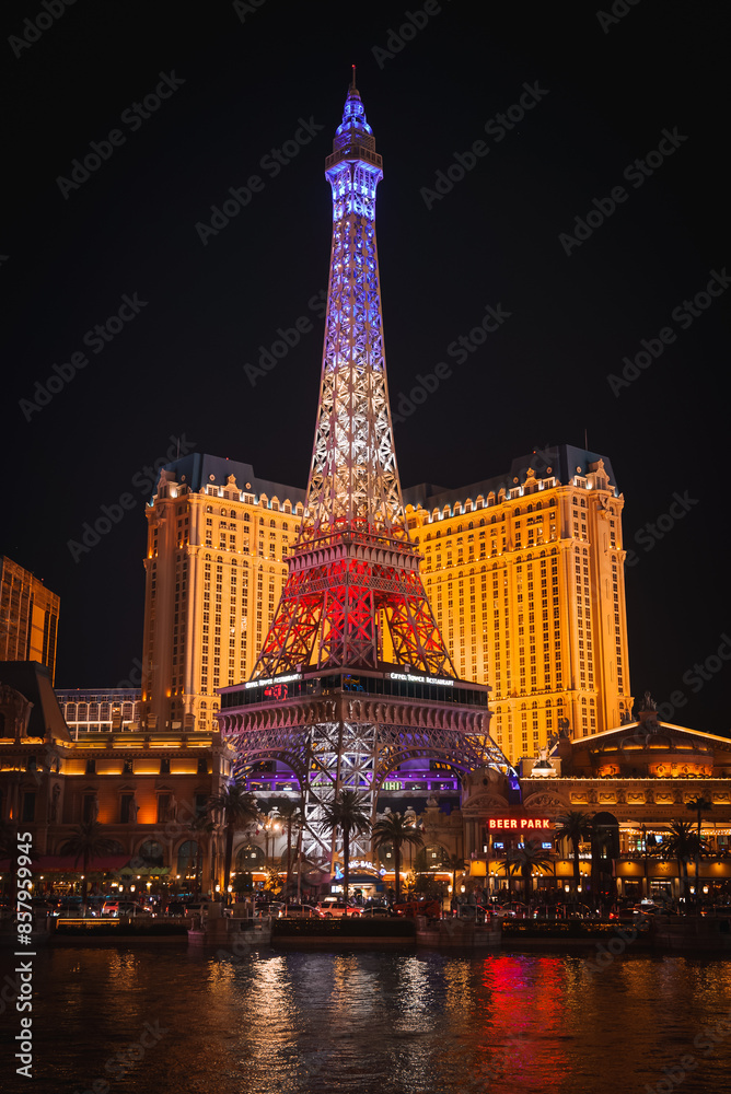 Vibrant night scene on the Las Vegas Strip, showcasing the Eiffel Tower replica at Paris Las ...