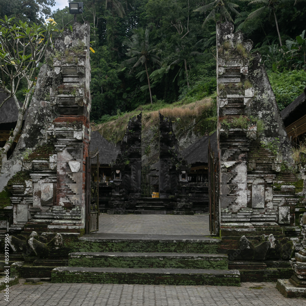 Bali gate (aka Candi bentar) is a split gateway made of stone and looks ...